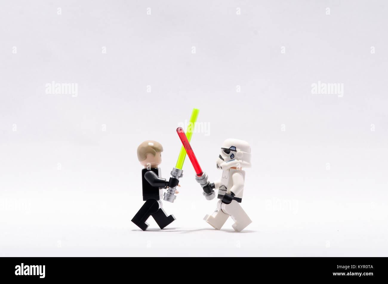 lego luke sky walker fighting storm trooper using light saber. isolated ...