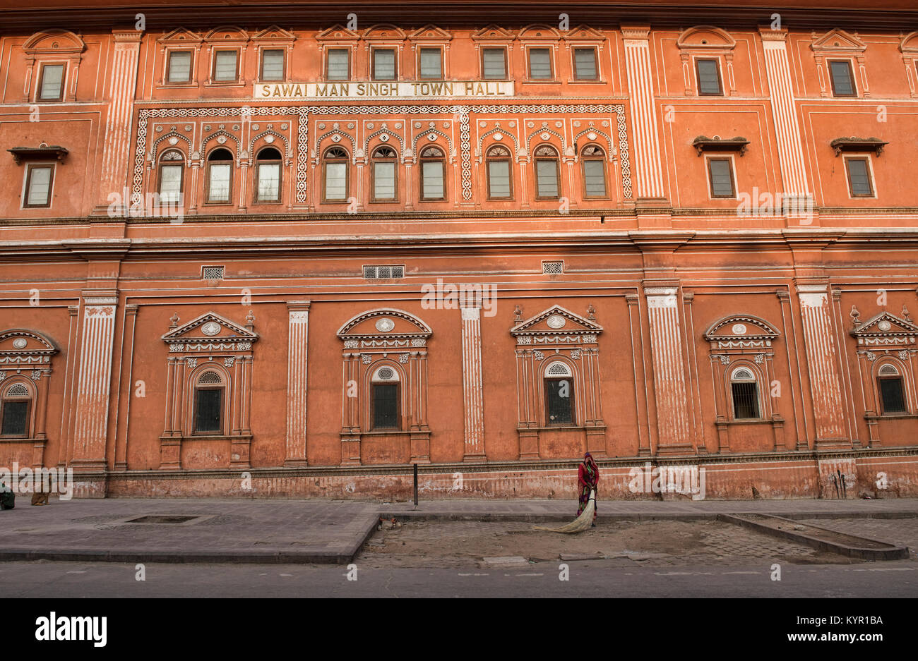 Sweeper in front of the pink stucco Sawai Man Singh Assembly Hall ...