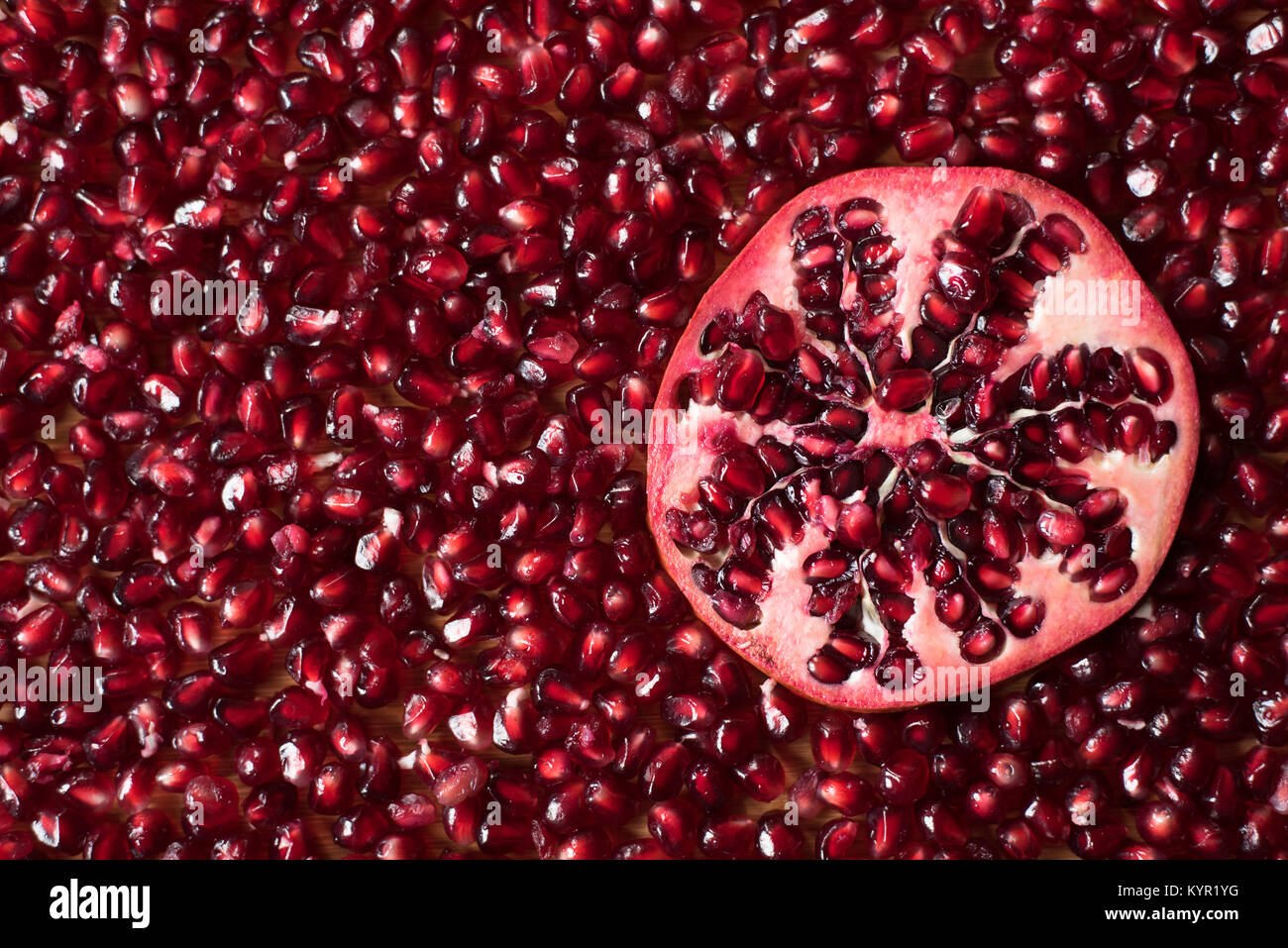 cross section of pomegranate and seeds for background, wallpaper and ...