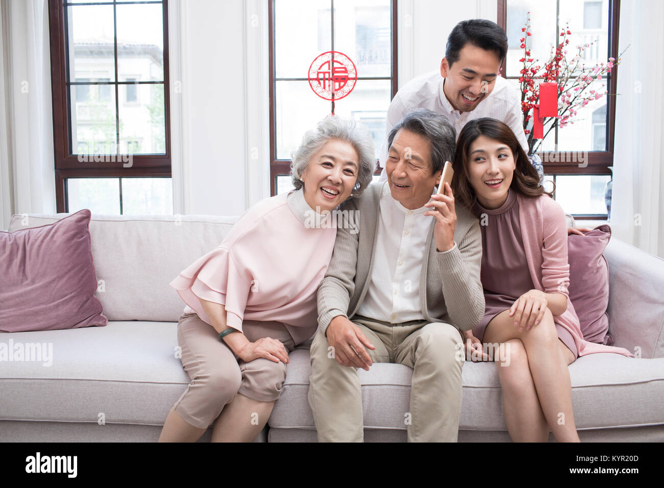 Happy young chinese family hi-res stock photography and images - Alamy