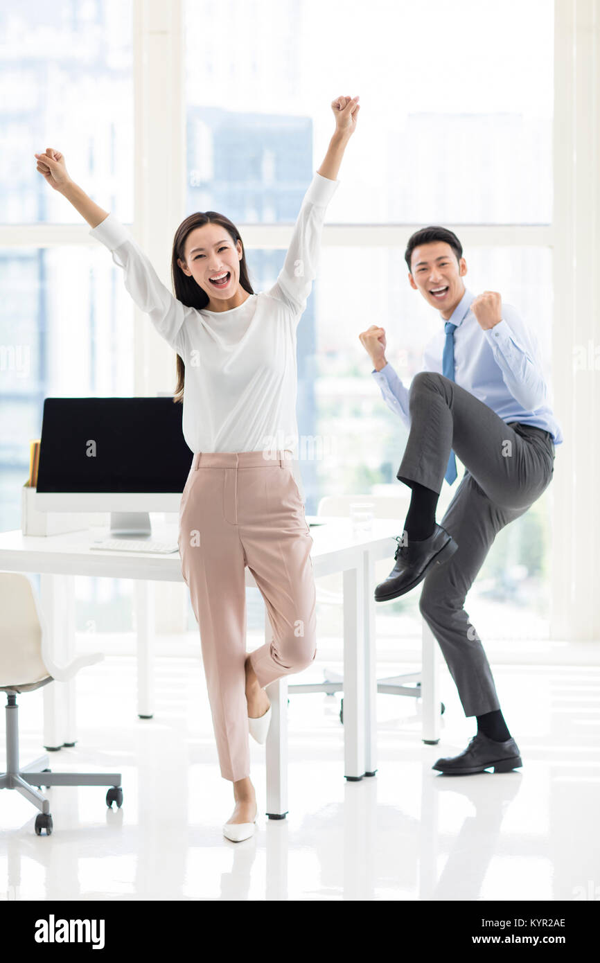 Business people cheering in office hi-res stock photography and images ...