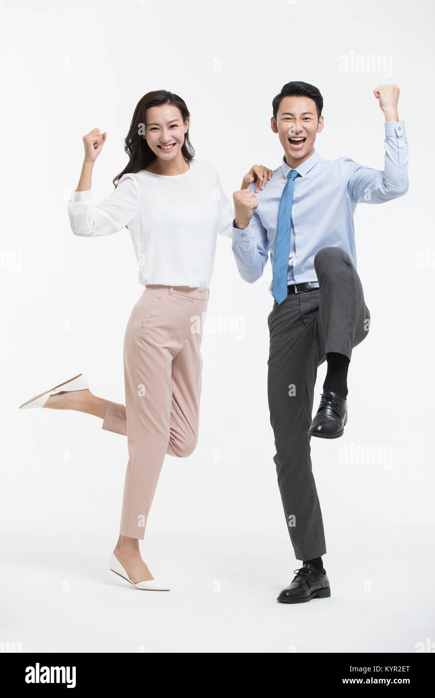 Young business people cheering Stock Photo - Alamy