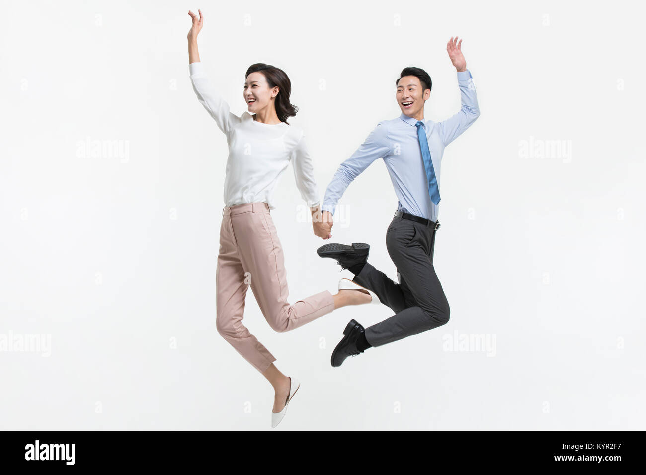Jumping holding hands two hi-res stock photography and images - Alamy