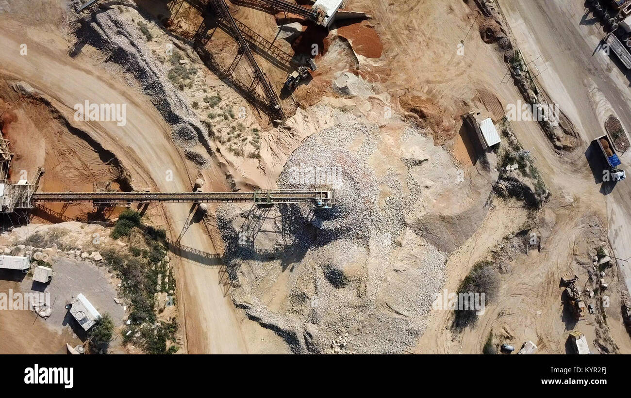 Stone sorting conveyor belt in a large Quarry - Top down aerial view ...