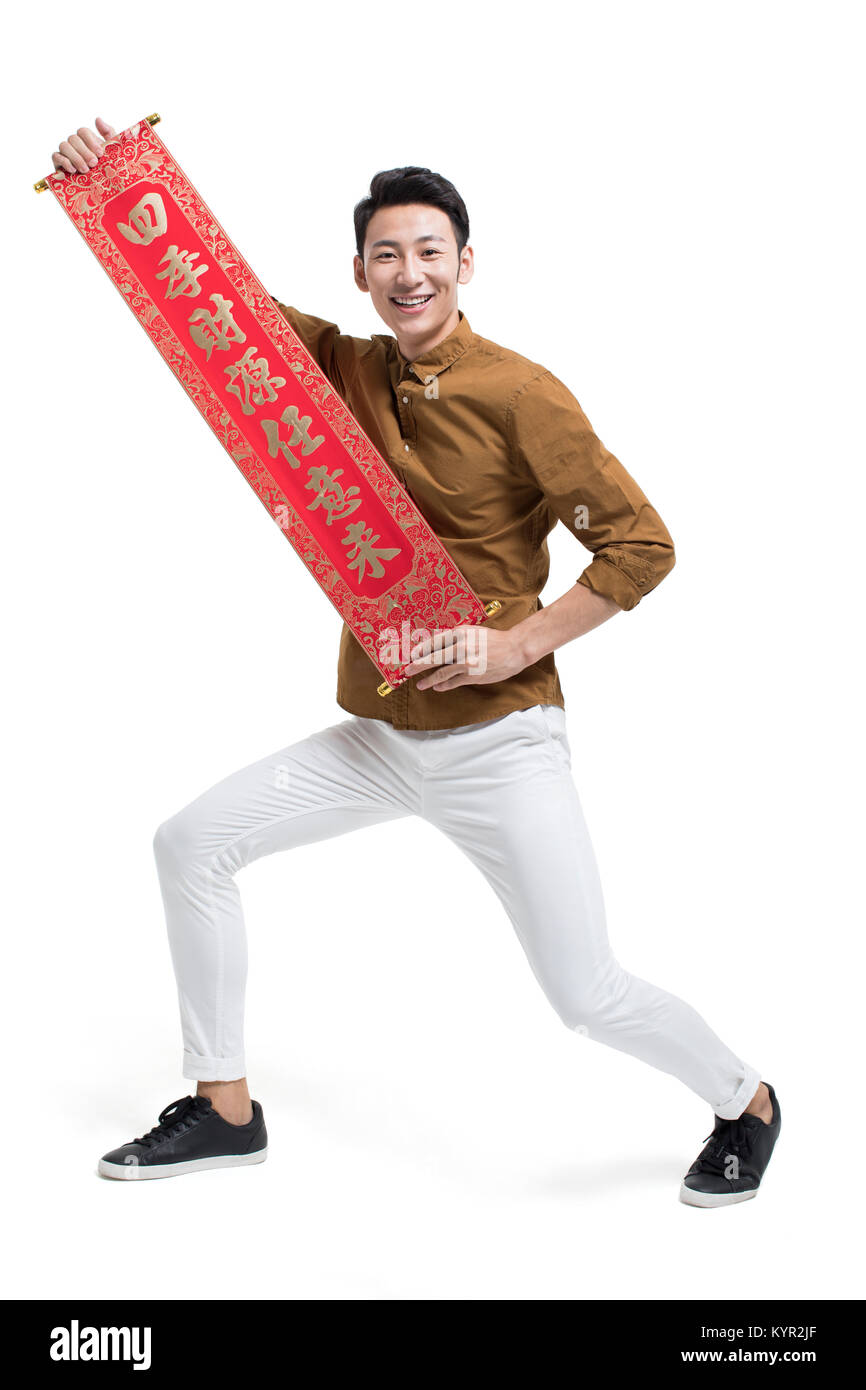 Cheerful young man with couplet celebrating Chinese new year Stock ...