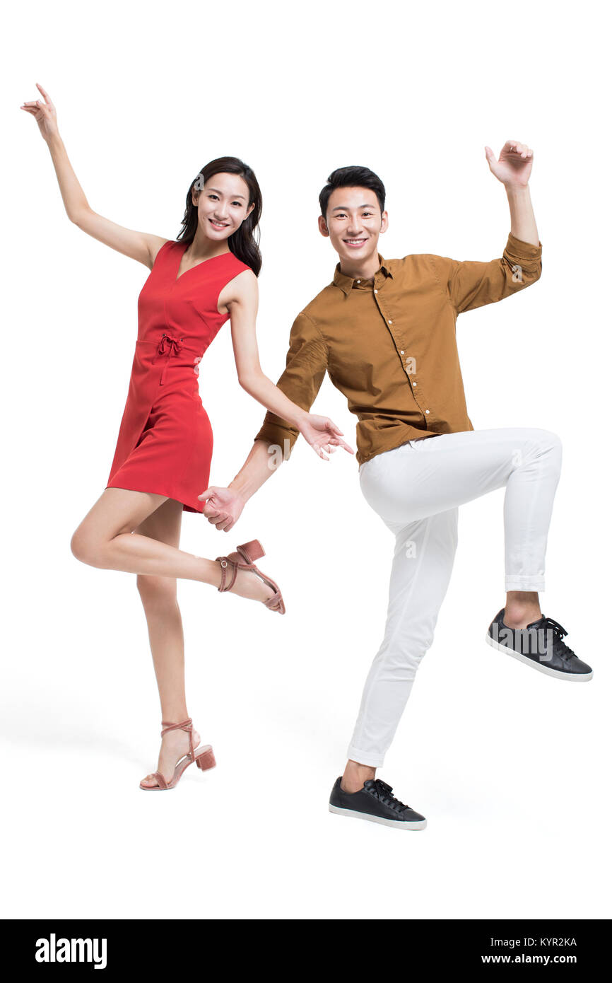 Cheerful young couple dancing Stock Photo - Alamy