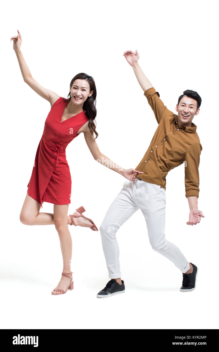 Cheerful young couple dancing Stock Photo - Alamy