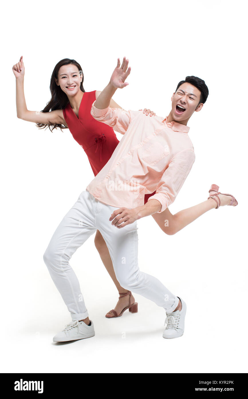 Cheerful young couple dancing Stock Photo - Alamy