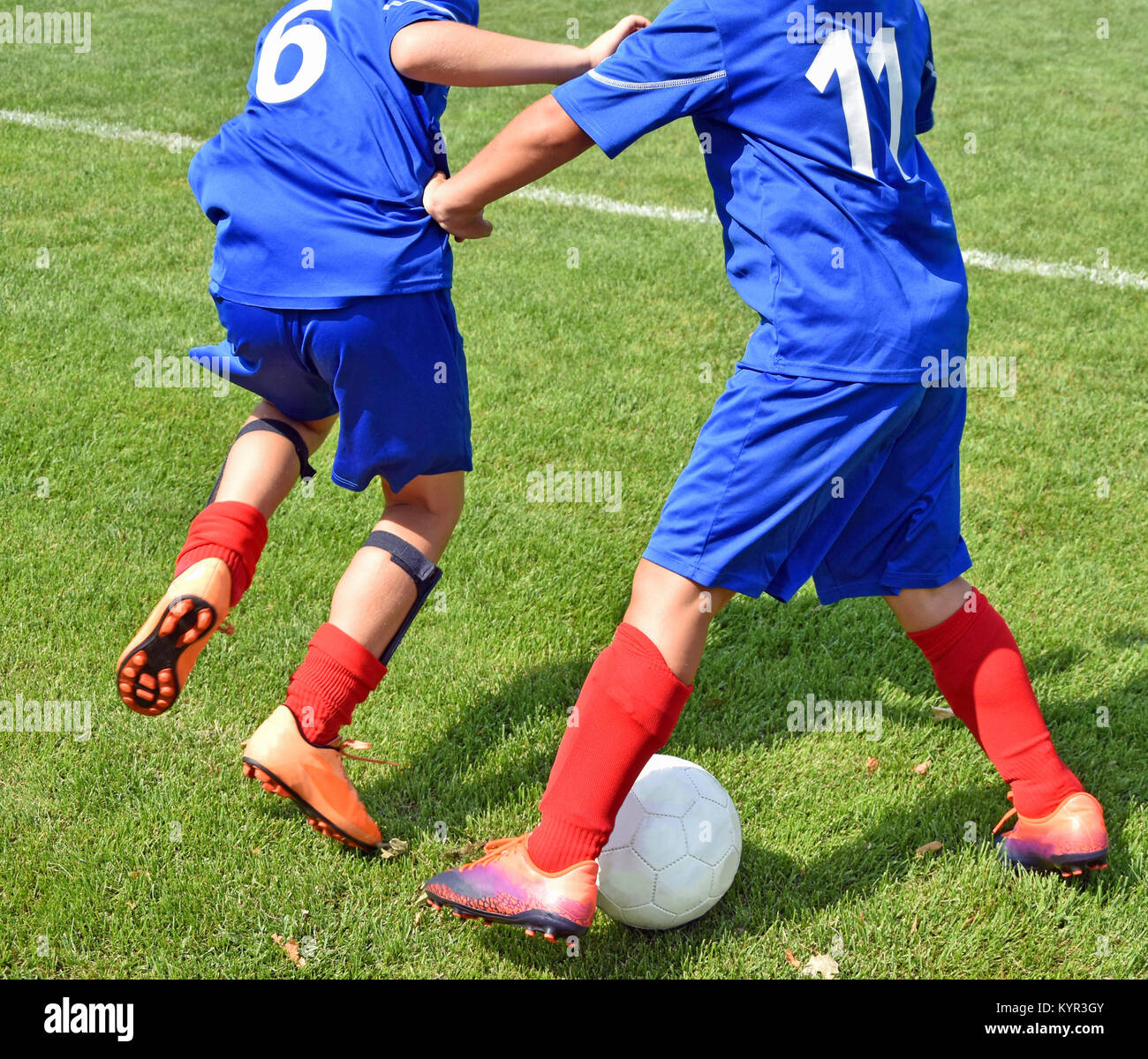 Kids are playing soccer outdoor Stock Photo - Alamy