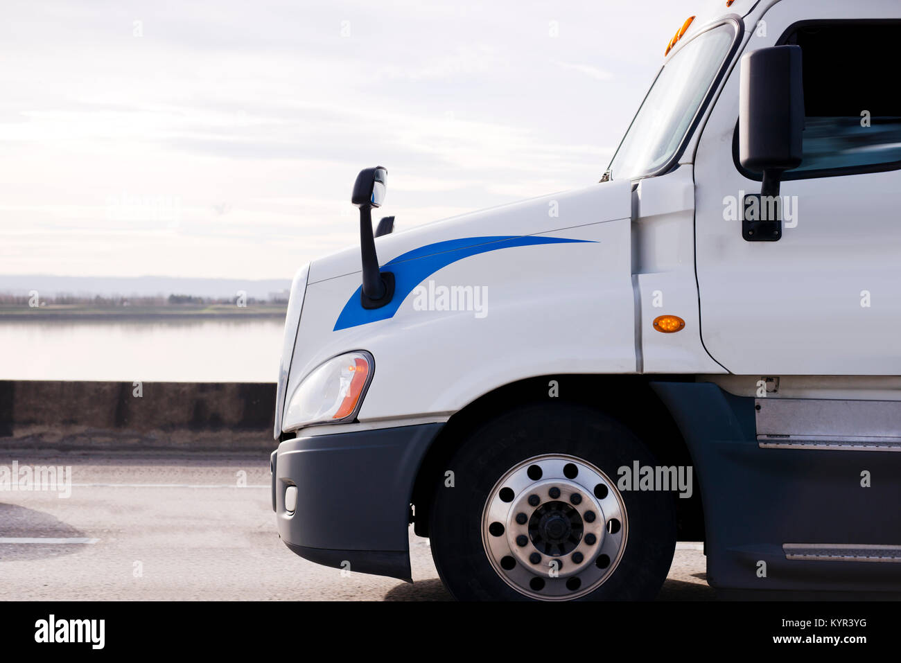 Big rig american king of roads white semi truck driving by interstate ...