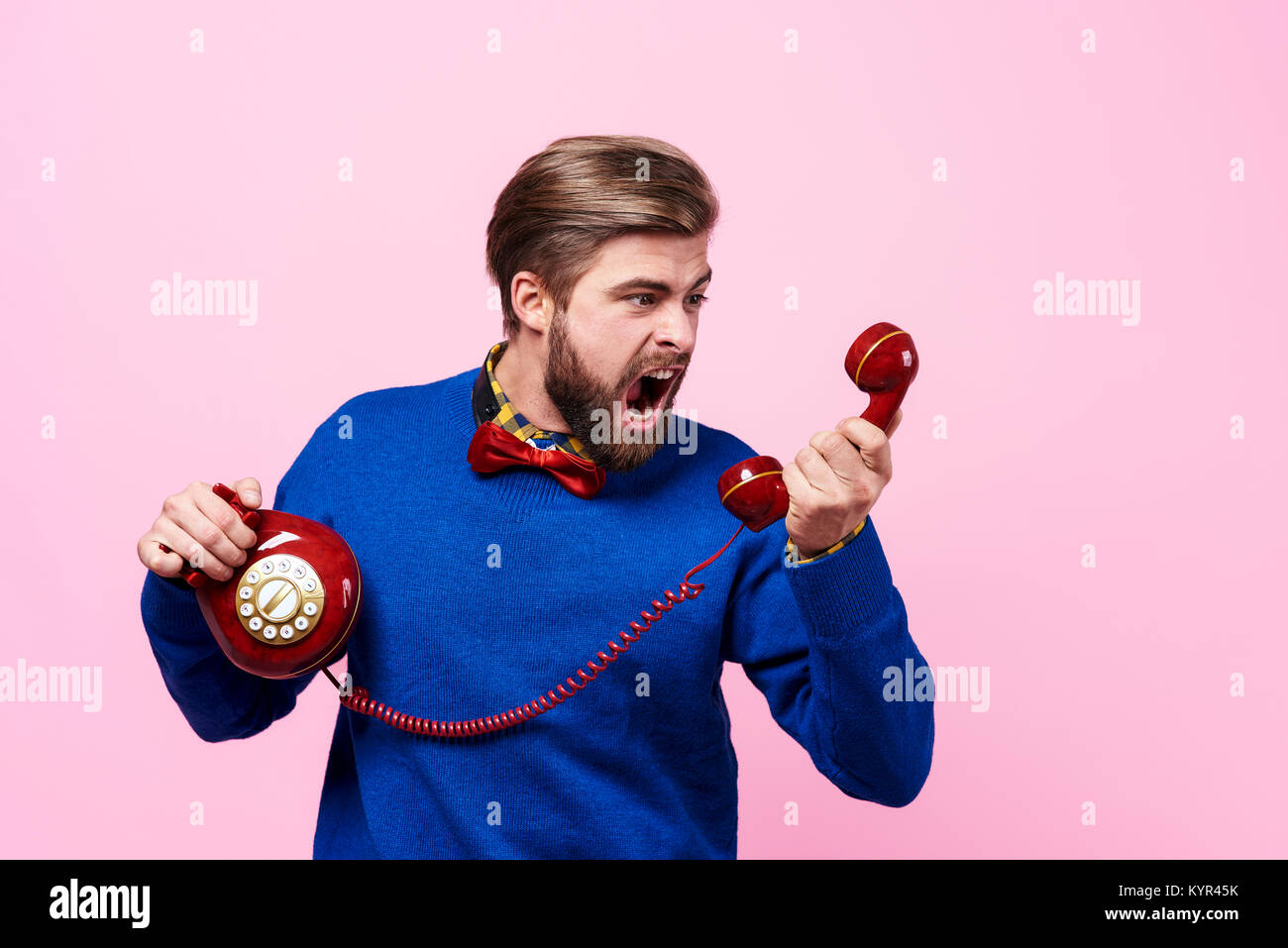Nervous man arguing during phone call Stock Photo - Alamy