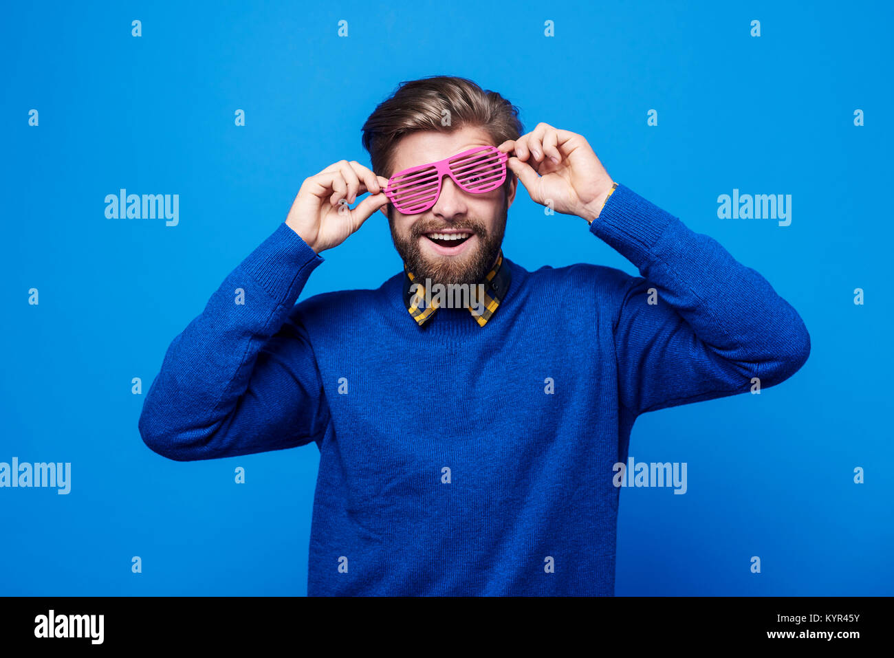 Man funny glasses laughing holding hi-res stock photography and images ...