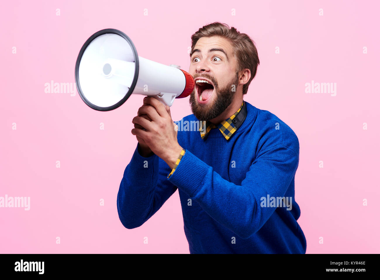 Man yelling into a megaphone Stock Photo - Alamy