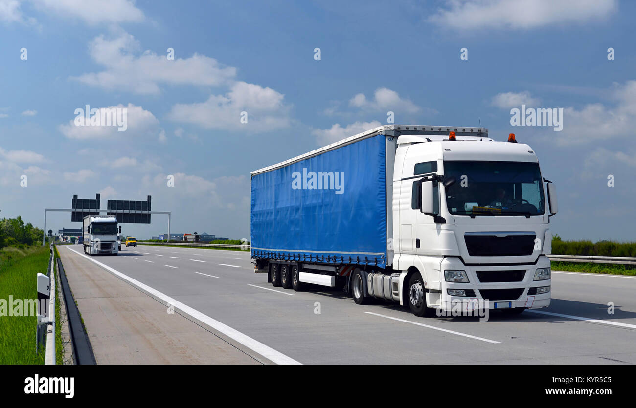 Truck transports goods by road - shipping and logistics Stock Photo - Alamy