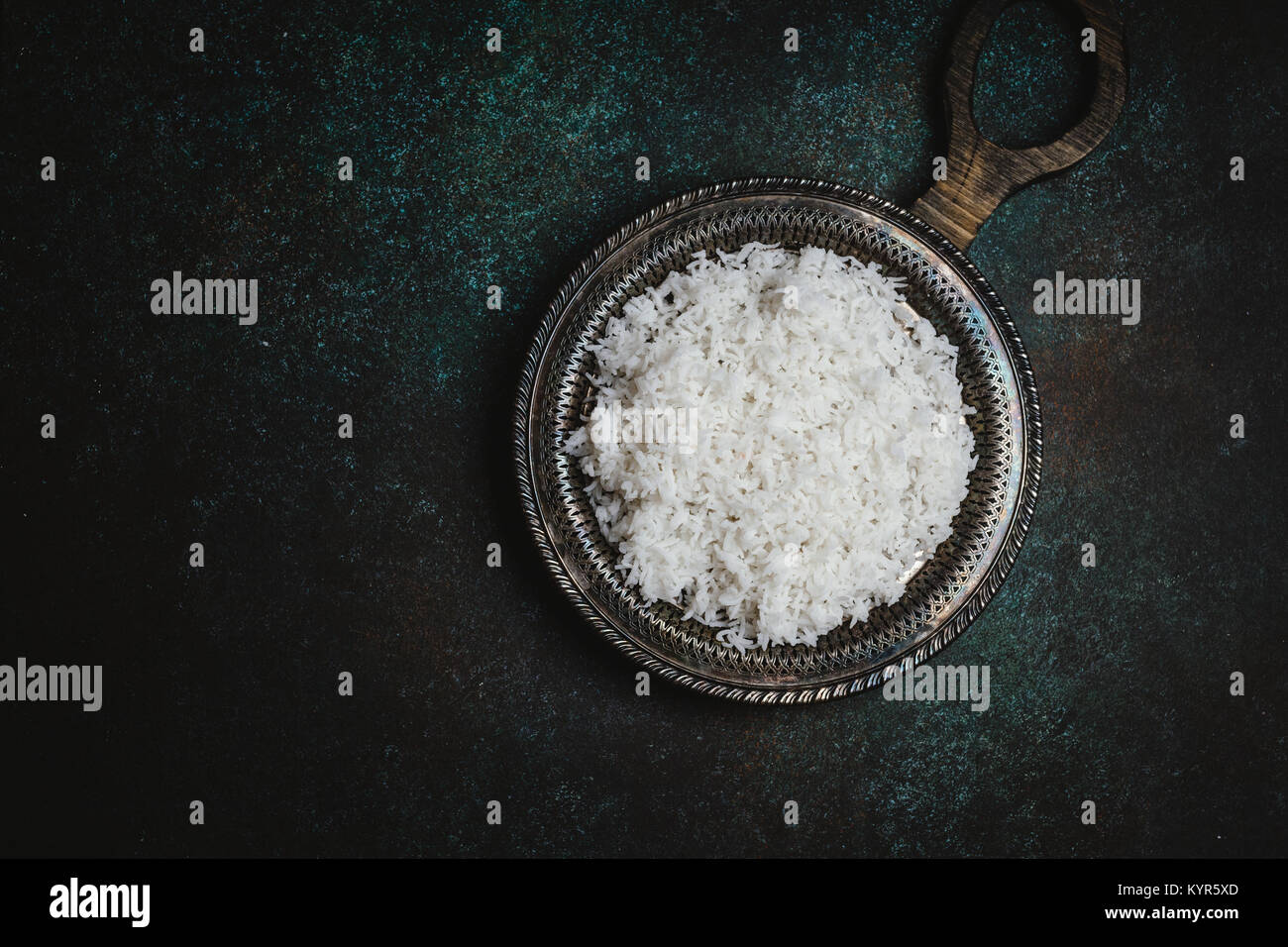 Top view of cooked white rice on rustic metal tray on dark table Stock ...