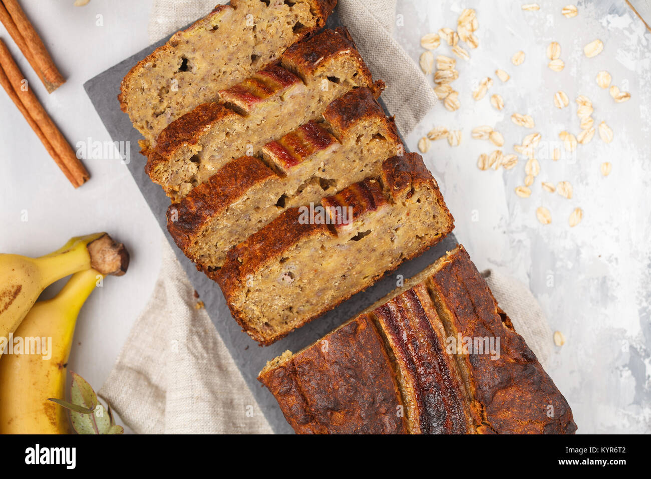 Sliced banana bread with cinnamon on a black slate. Vegan Healthy Food ...