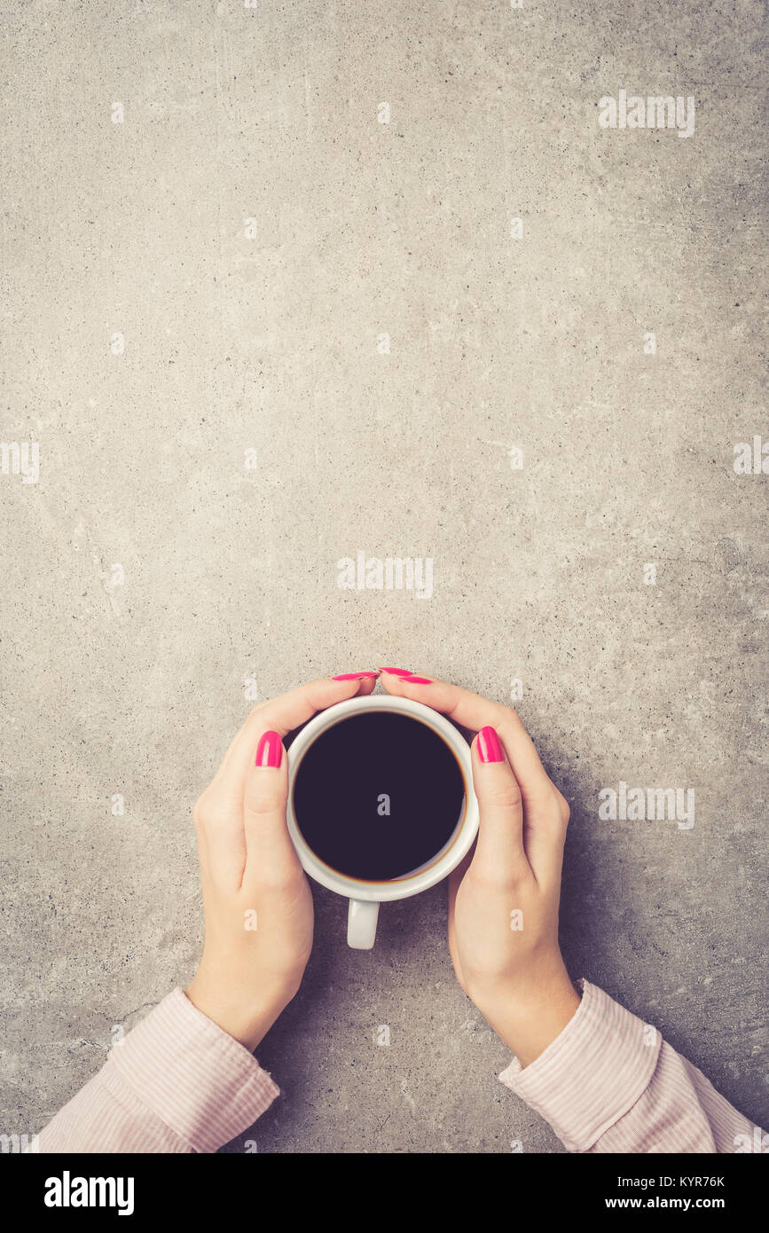 Female hands holding coffee cup Stock Photo - Alamy