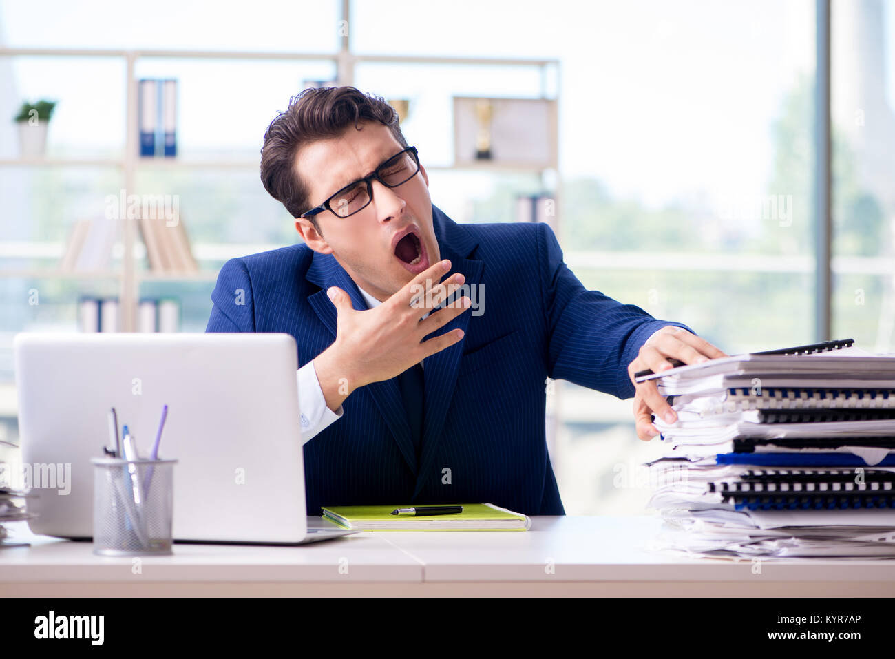 Tired businessman exhausted after hard work and excessive workload ...