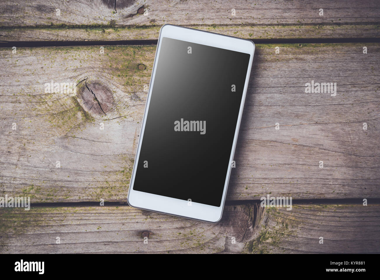 Modern smart phone on an old wooden table Stock Photo - Alamy