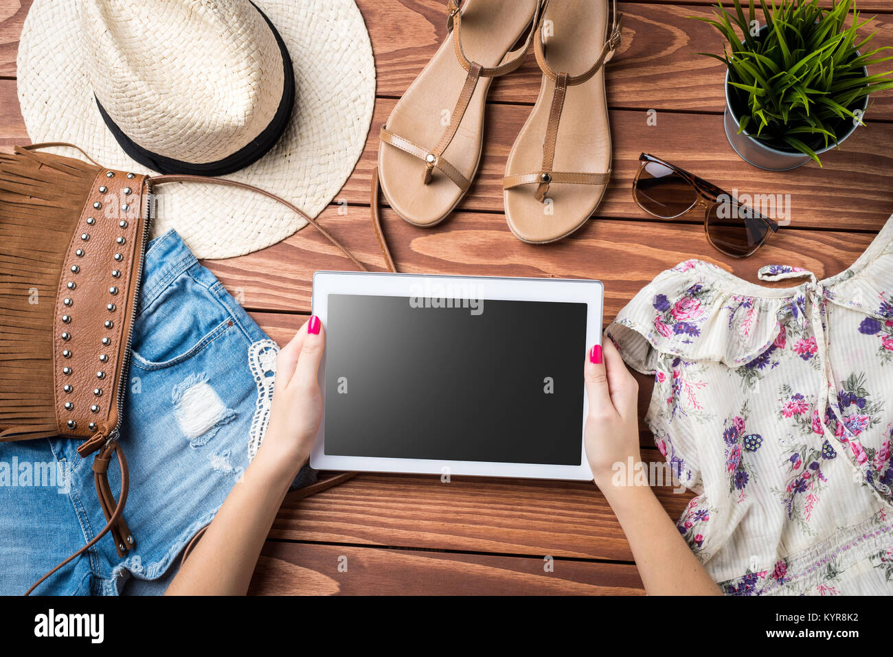 Women's summer clothes on wooden table. Fashion background Stock Photo ...