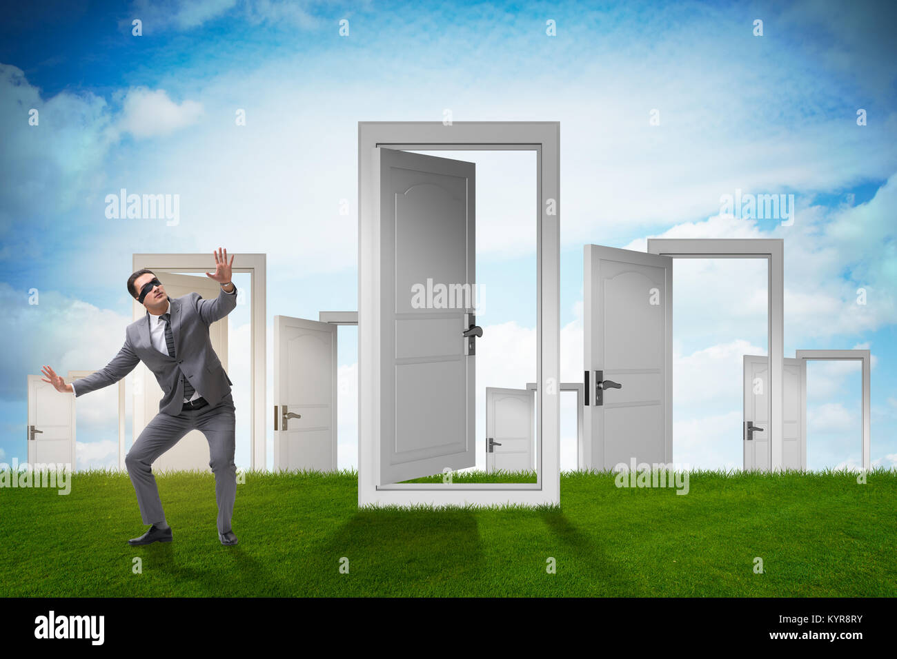 Confused businessman in front of doors Stock Photo - Alamy
