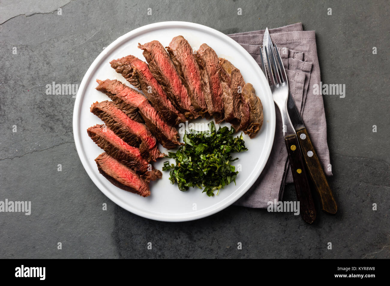 Medium beef steak on white plate, slate background. Top view Stock ...