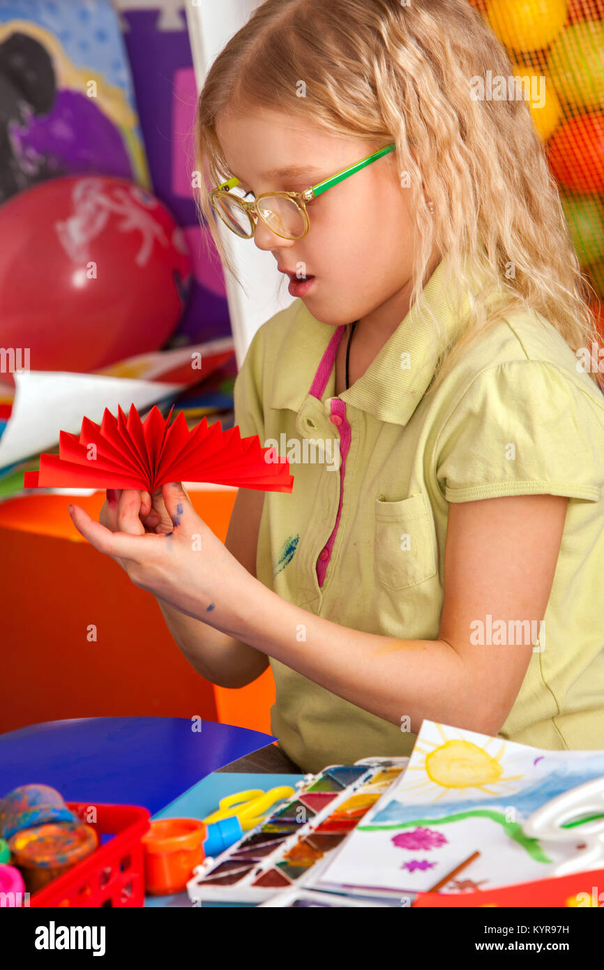 School children with scissors in kids hands cutting paper Stock Photo ...