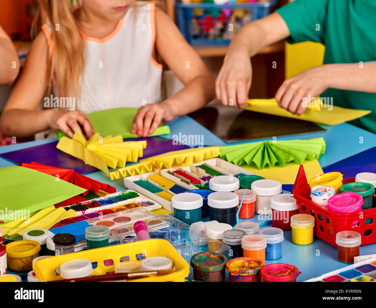 School children with scissors in kids hands cutting paper Stock Photo ...
