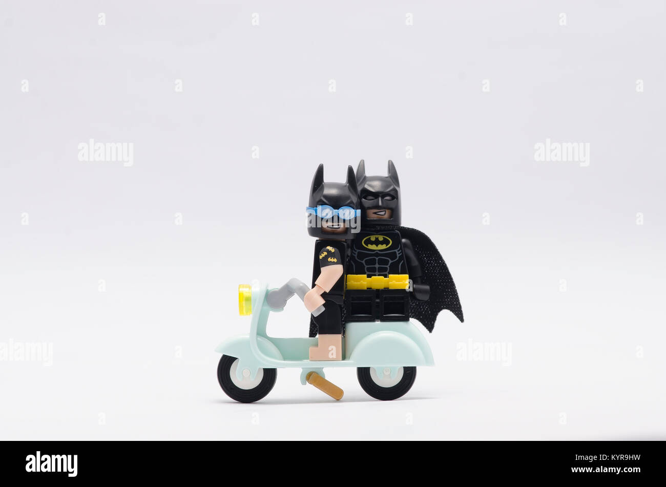 lego vacation batman and batman riding a scooter. isolated on white ...