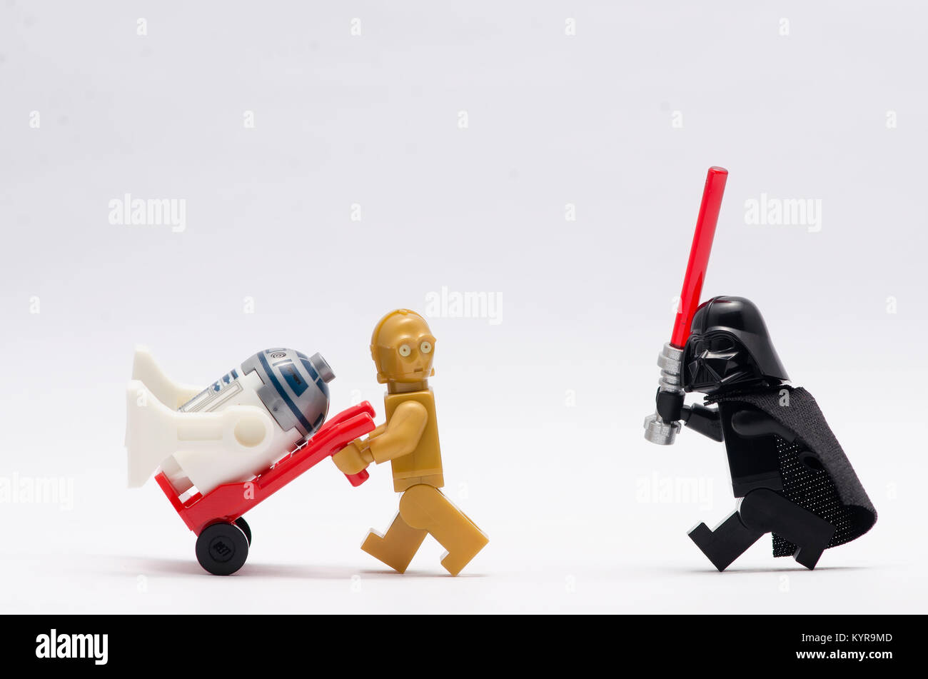 lego darth vader chasing c3po and r2d2. isolated on white background ...