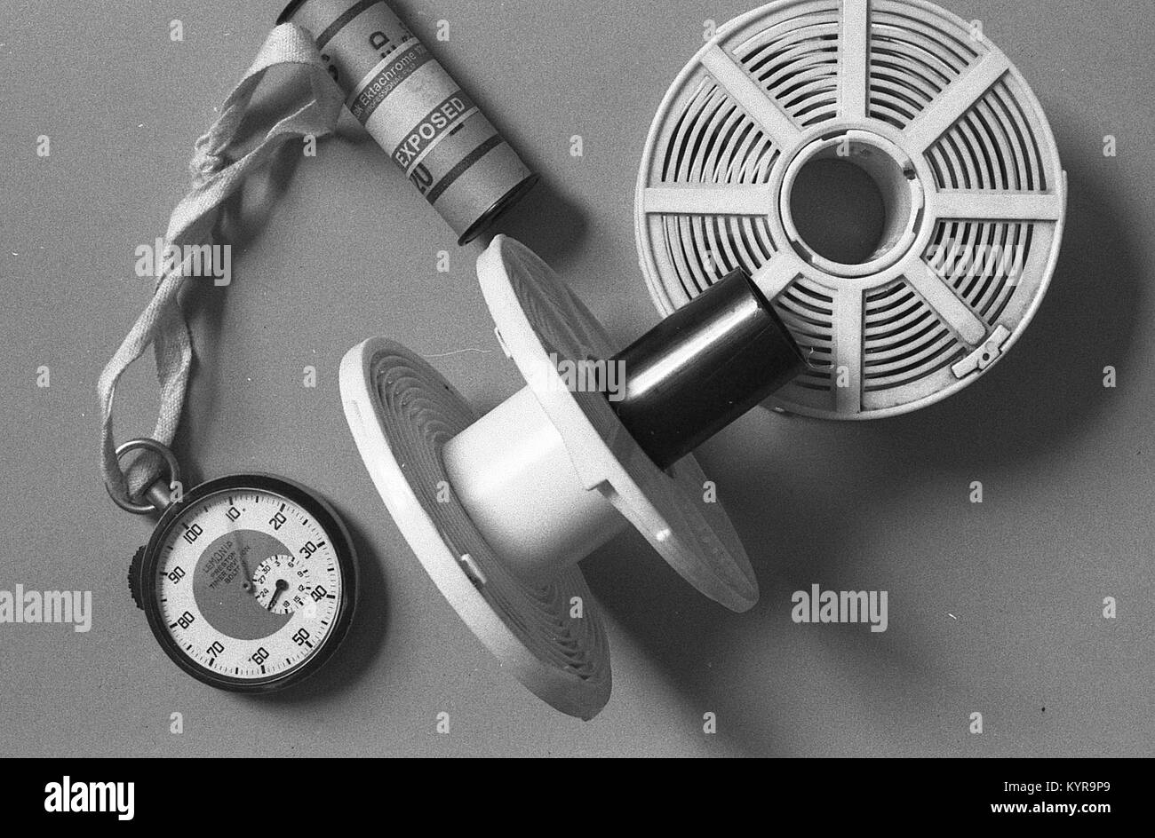 roll of film, developing tank spool and a stop watch Stock Photo - Alamy