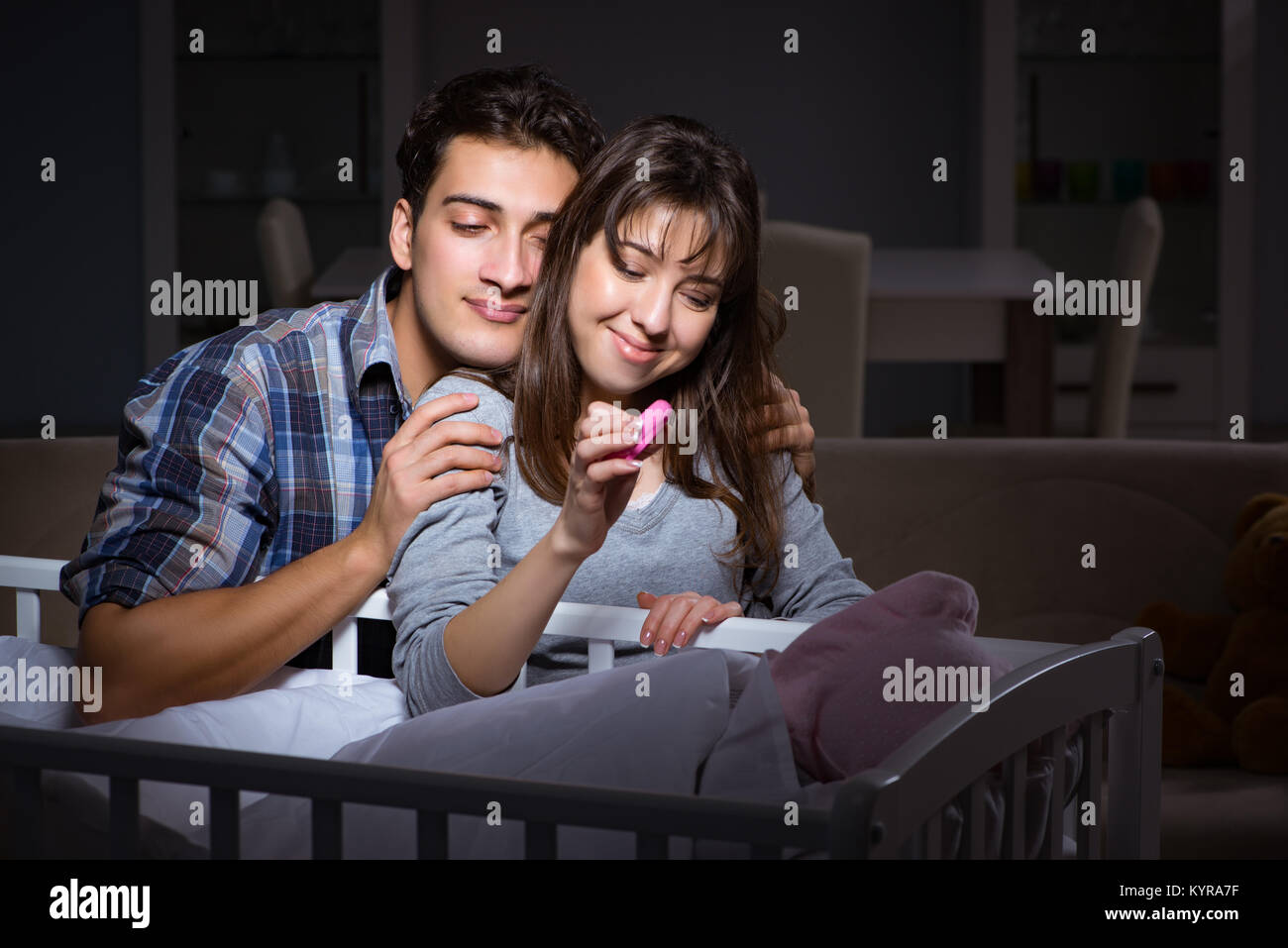 Young parents sleepless with newborn baby at night Stock Photo - Alamy