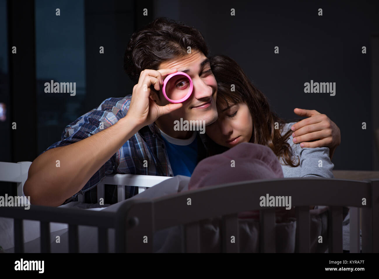Young parents sleepless with newborn baby at night Stock Photo - Alamy