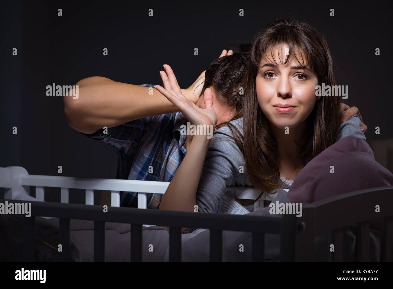 Young parents sleepless with newborn baby at night Stock Photo - Alamy