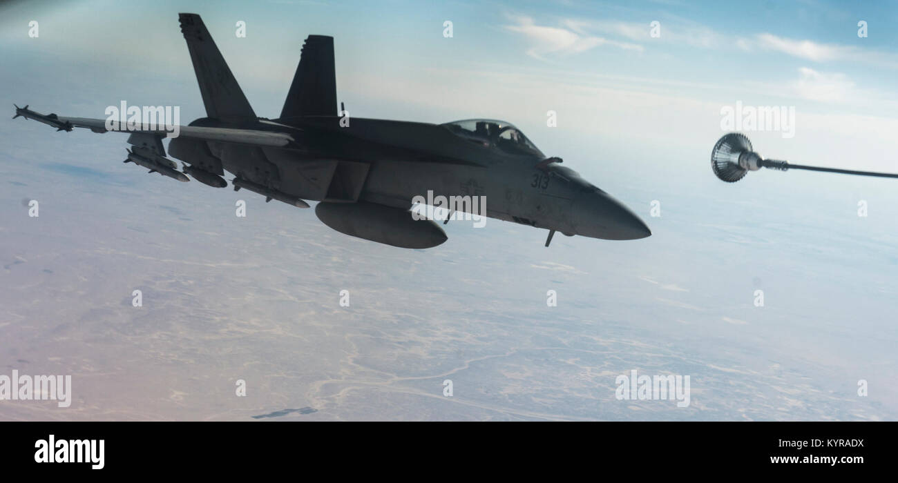 A U.S. Navy F/A-18 Superhornet performs refueling operations with a U.S ...