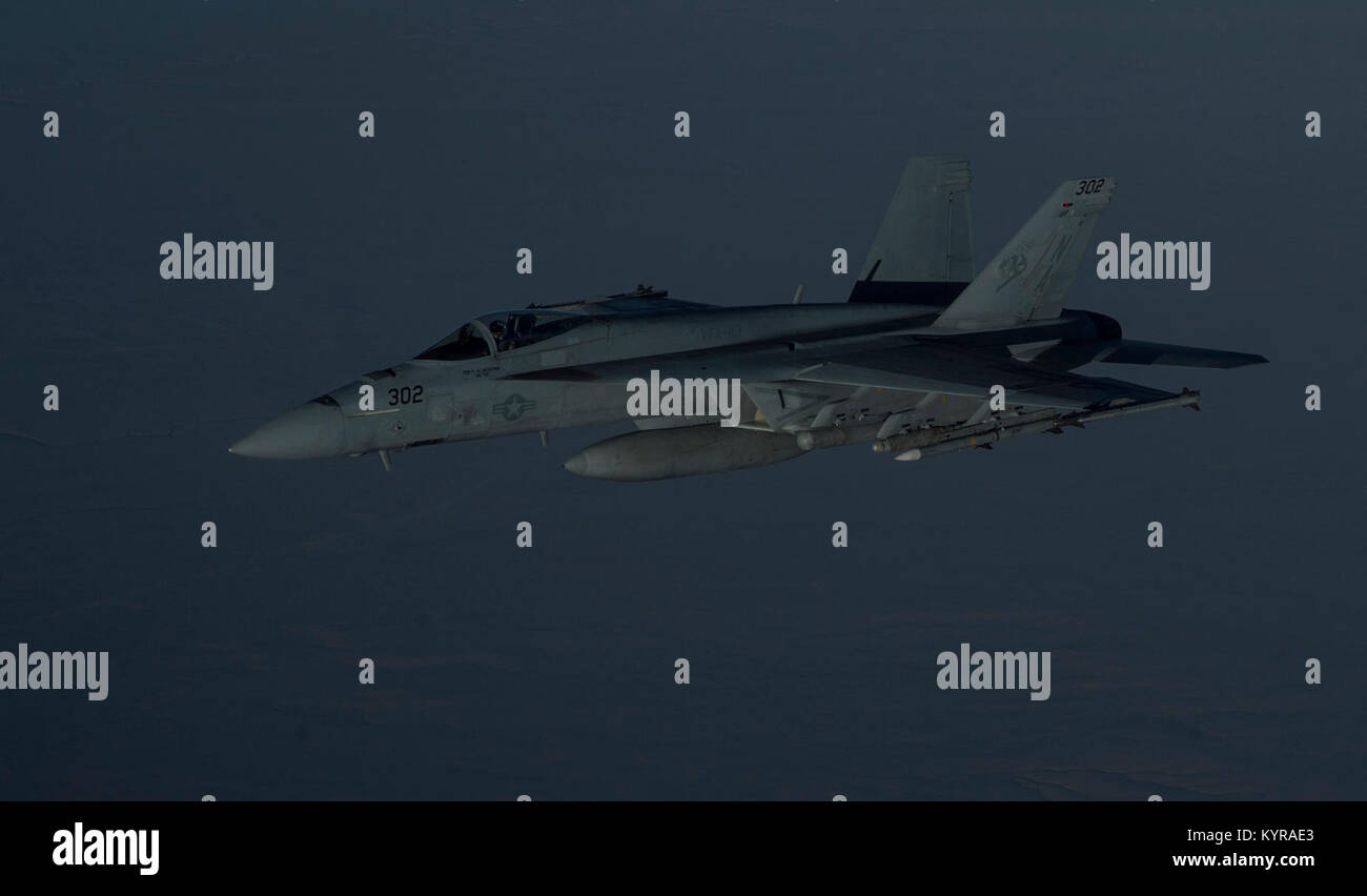 A U.S. Navy F/A-18 Superhornet performs an air patrol over Iraq and ...
