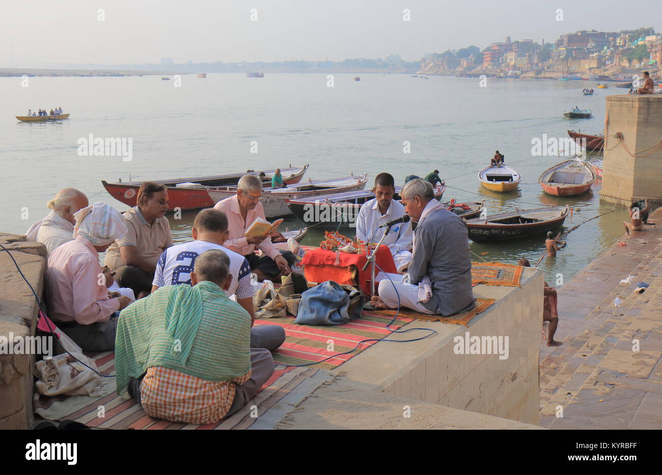 People gather for religious chant on Ganges river Varanasi India Stock ...