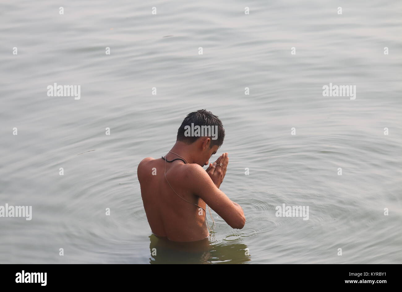 Indian man bathes in Ganges river Varanasi India Stock Photo - Alamy