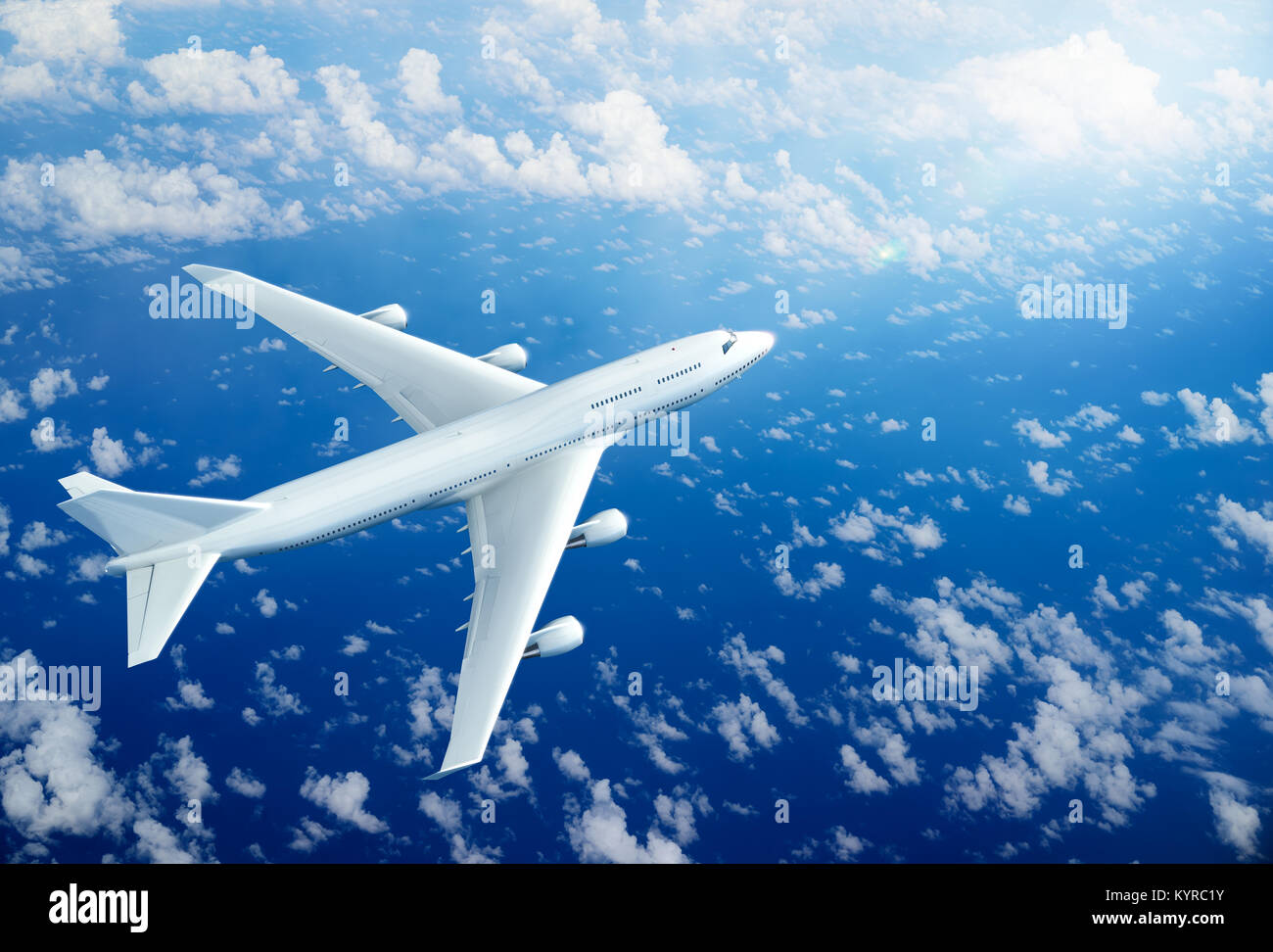 Airplane flying above clouds Stock Photo - Alamy