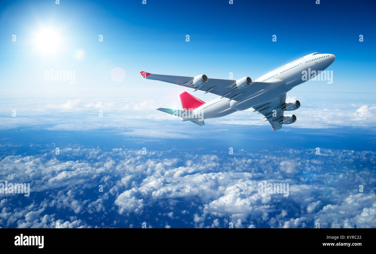 Airplane flying above clouds Stock Photo - Alamy