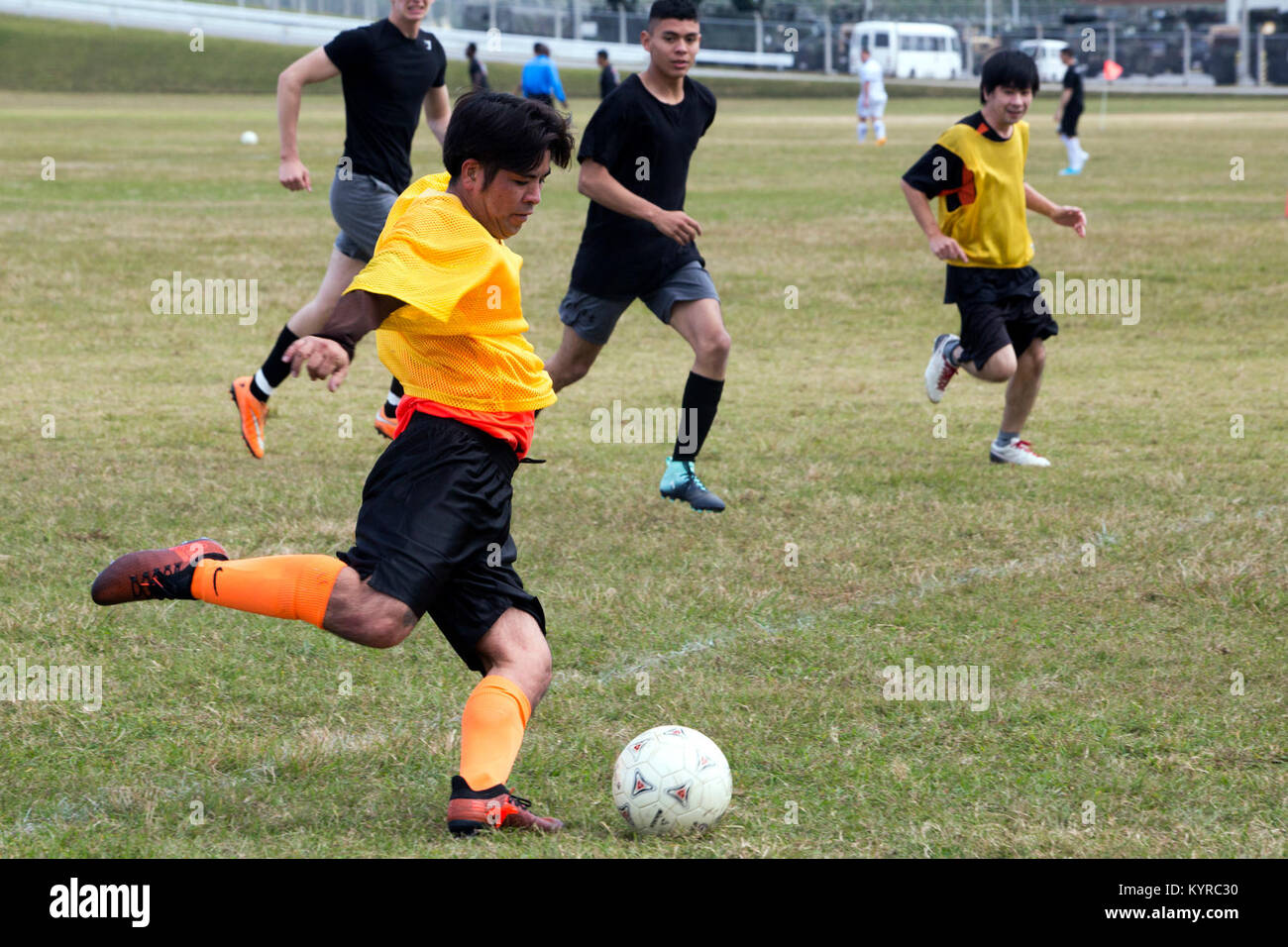 CAMP HANSEN, OKINAWA, Japan- Hideto Gushiken attempts to make a goal at ...