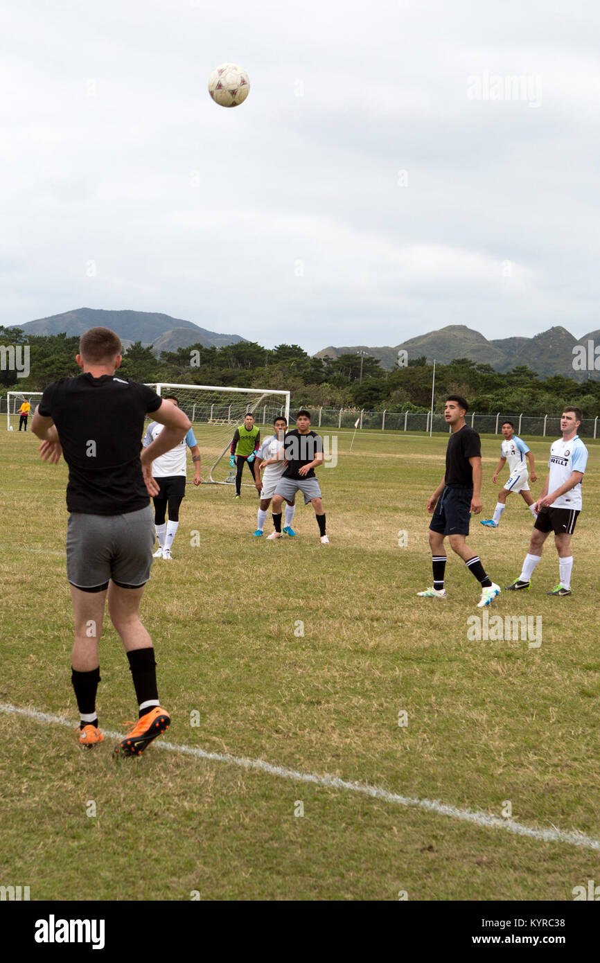 CAMP HANSEN, OKINAWA, Japan- A Marine from team Dirty Dozen throws the ...