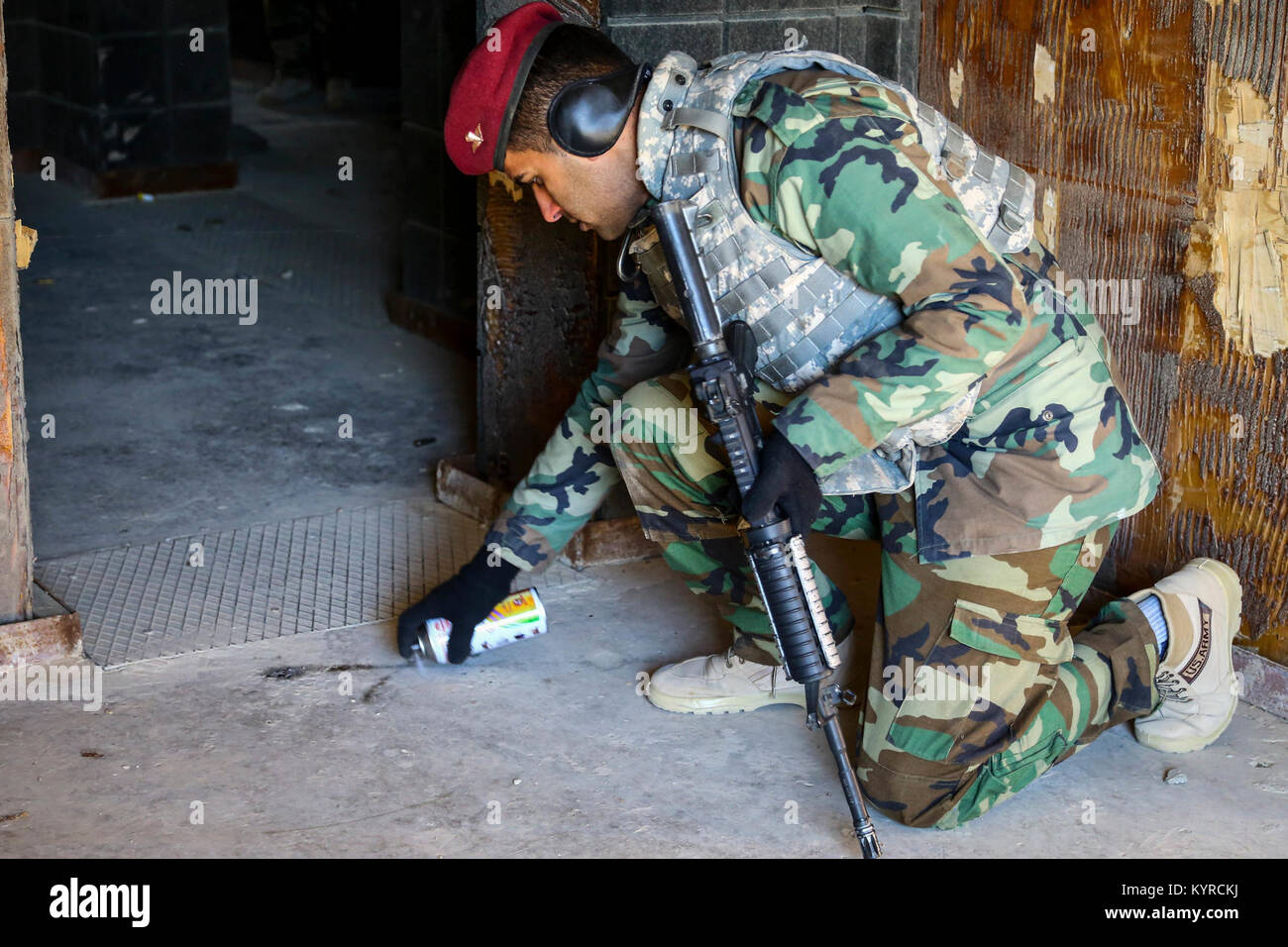 An Iraqi Soldier attached to the 61st Brigade, marks areas where ...