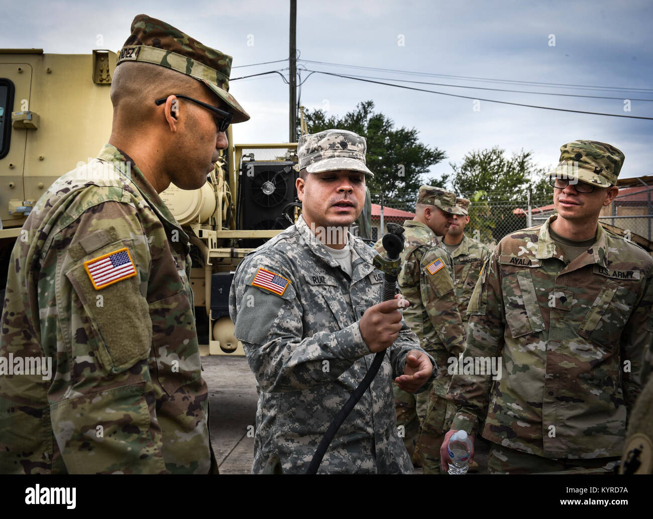 U.S. Army Spc. José Hernández (left), Spc. Christian Ruiz (center) and ...