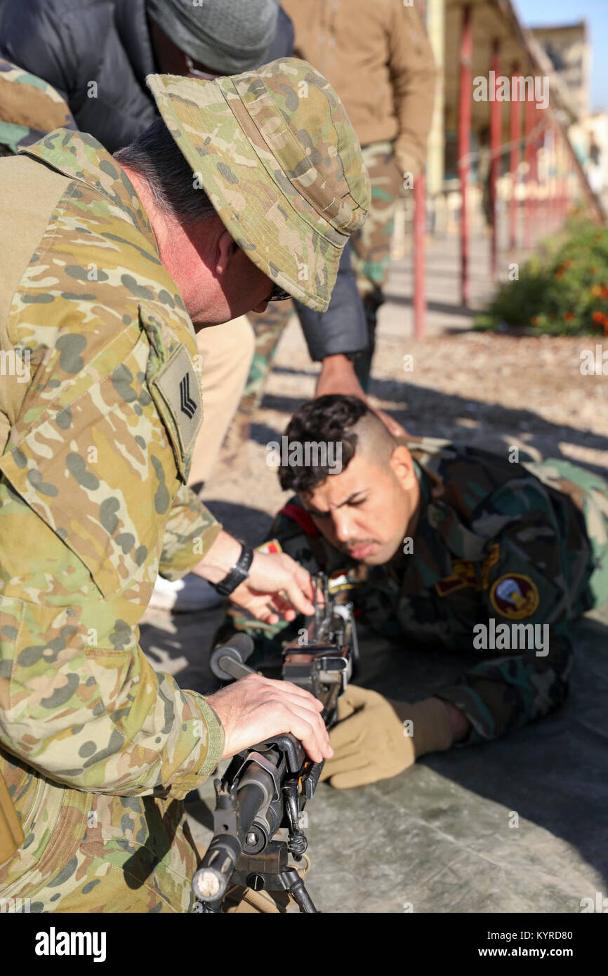 Australian Army Sgt. Jamie Tollan provides visual instruction to an ...