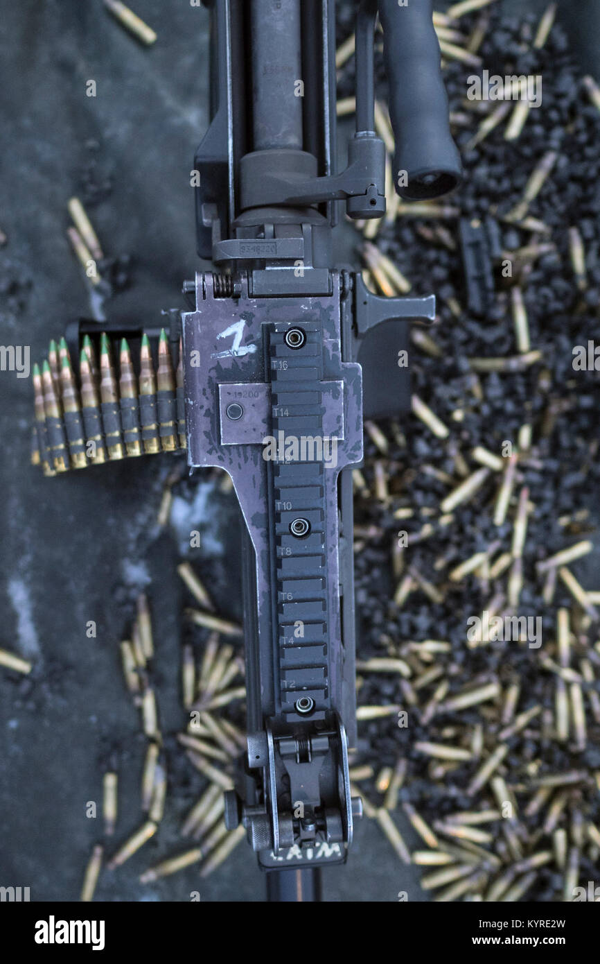 An M249 Squad Automatic Weapon is loaded and ready for Airmen assigned ...