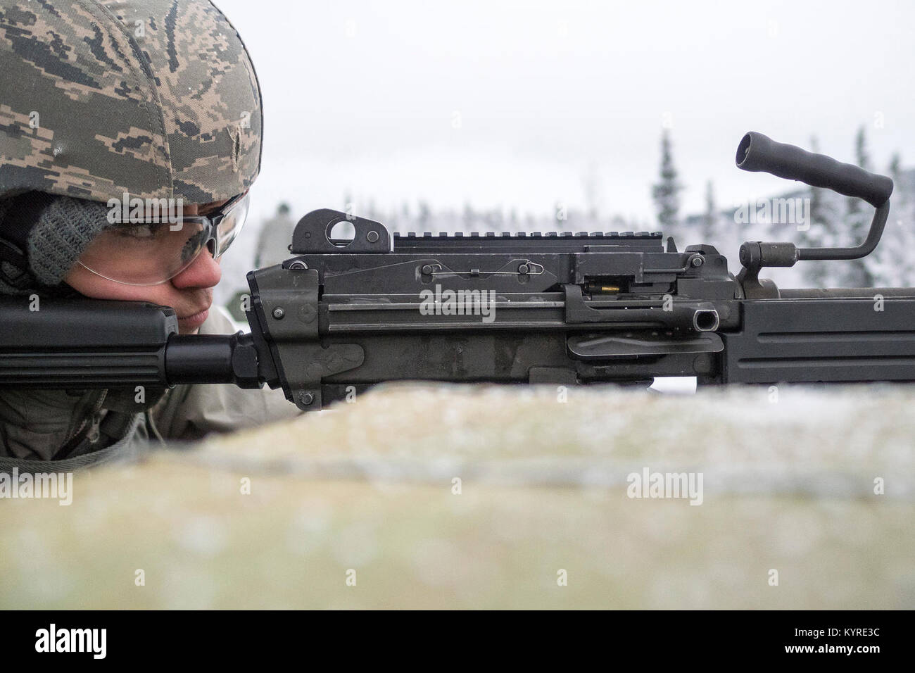An Airman assigned to the 673d Security Forces Squadron lines up a ...