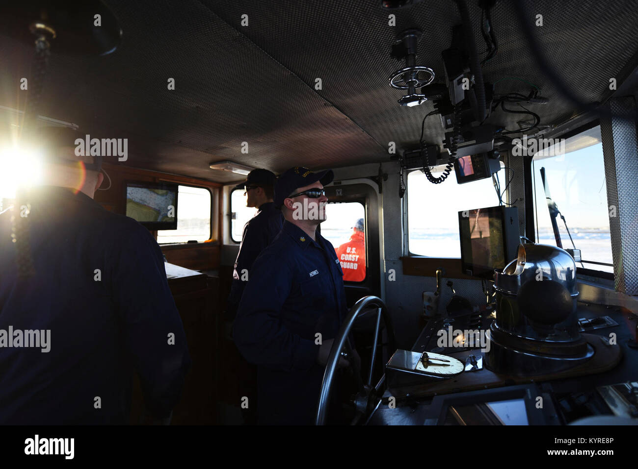 Petty Officer 1st Class Jason Hermes steers Coast Guard Cutter Shackle ...