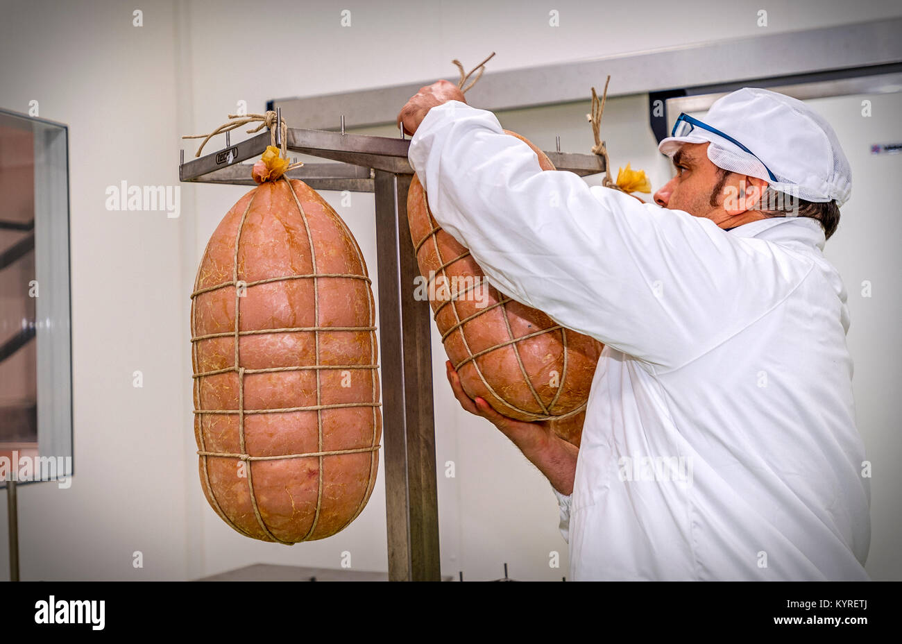 Fasi della lavorazione della mortadella hi-res stock photography and ...