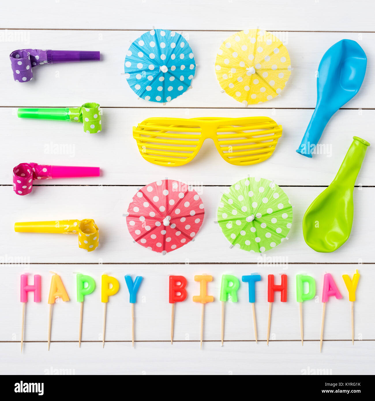 Birthday accessories on white wooden table. Top view Stock Photo - Alamy
